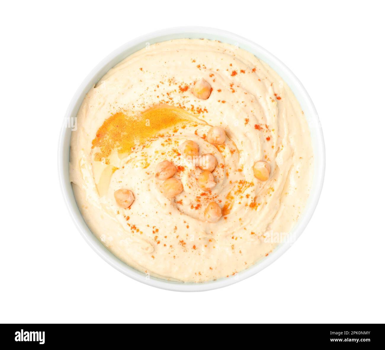 Tasty hummus with garnish in bowl isolated on white, top view Stock ...