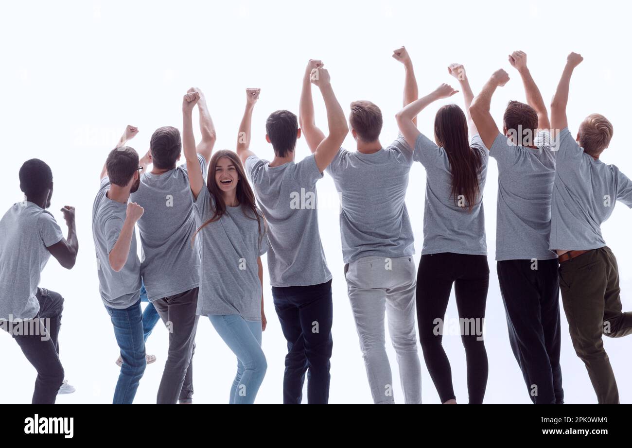 rear view. a group of happy young people looking forward Stock Photo ...