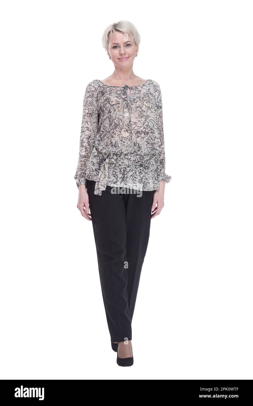 elegant young woman striding forward . isolated on a white background ...