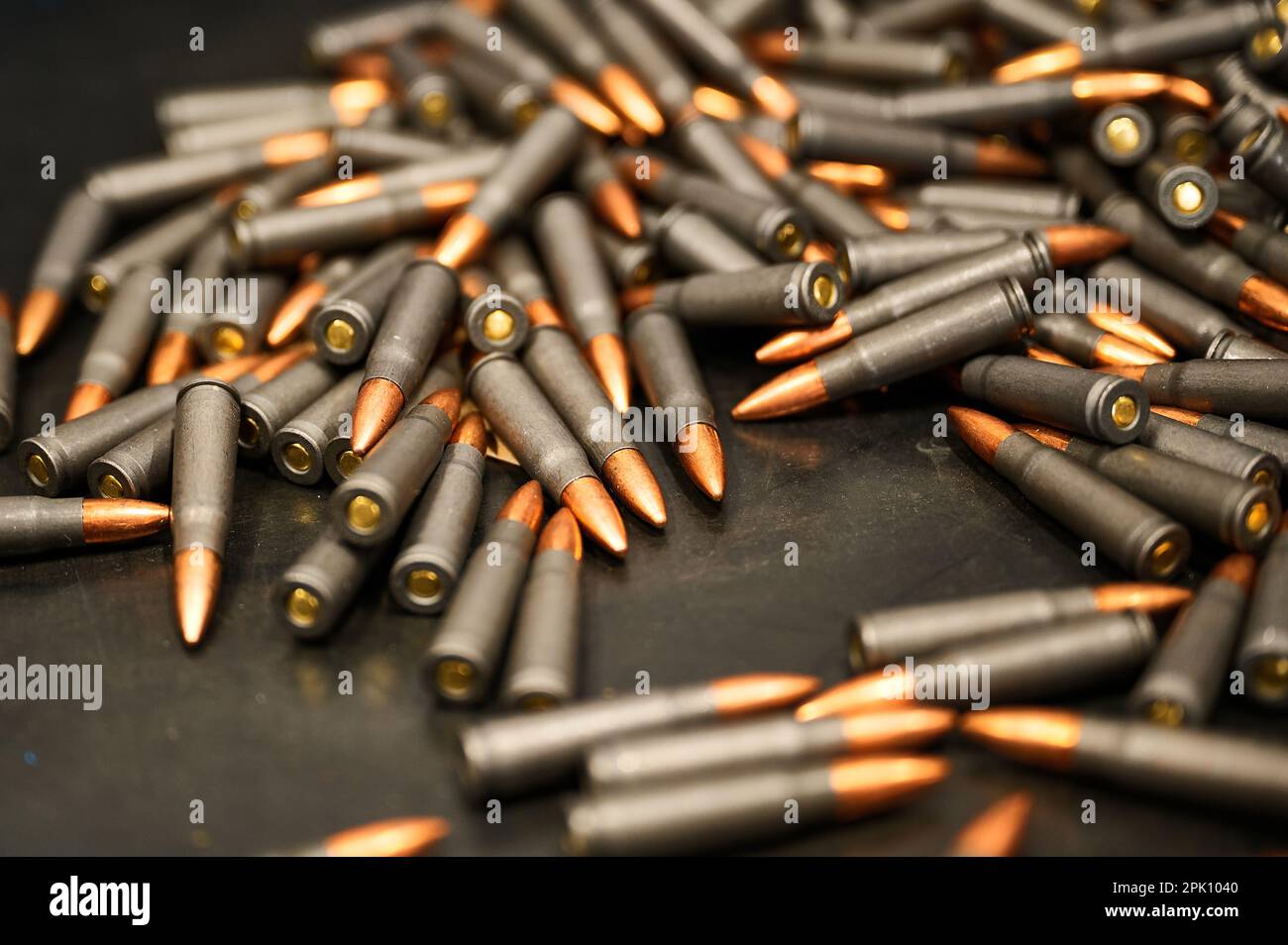 Scattered service cartridges on table at military plant Stock Photo - Alamy