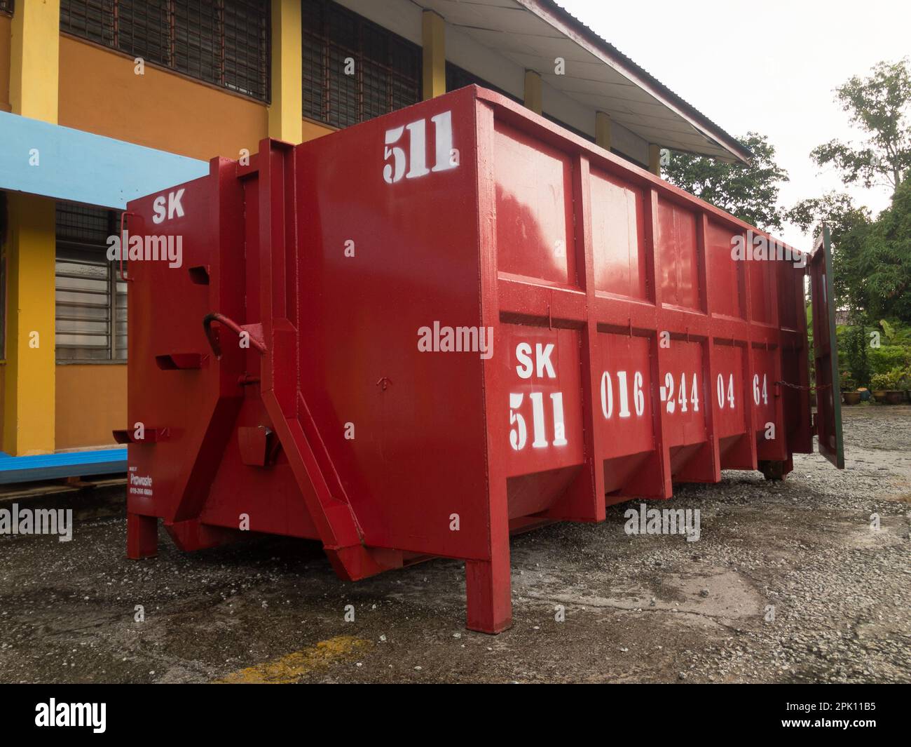 Metal garbage container outside the building. Selective focus Stock ...