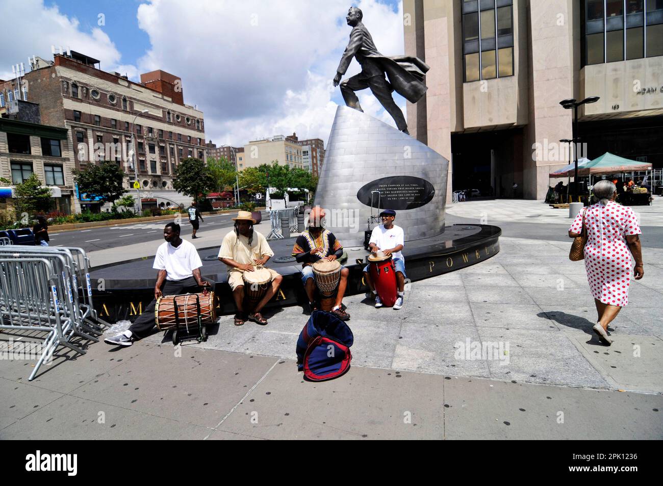 Street musicians playing by the Monument to Adam Clayton Powell in ...
