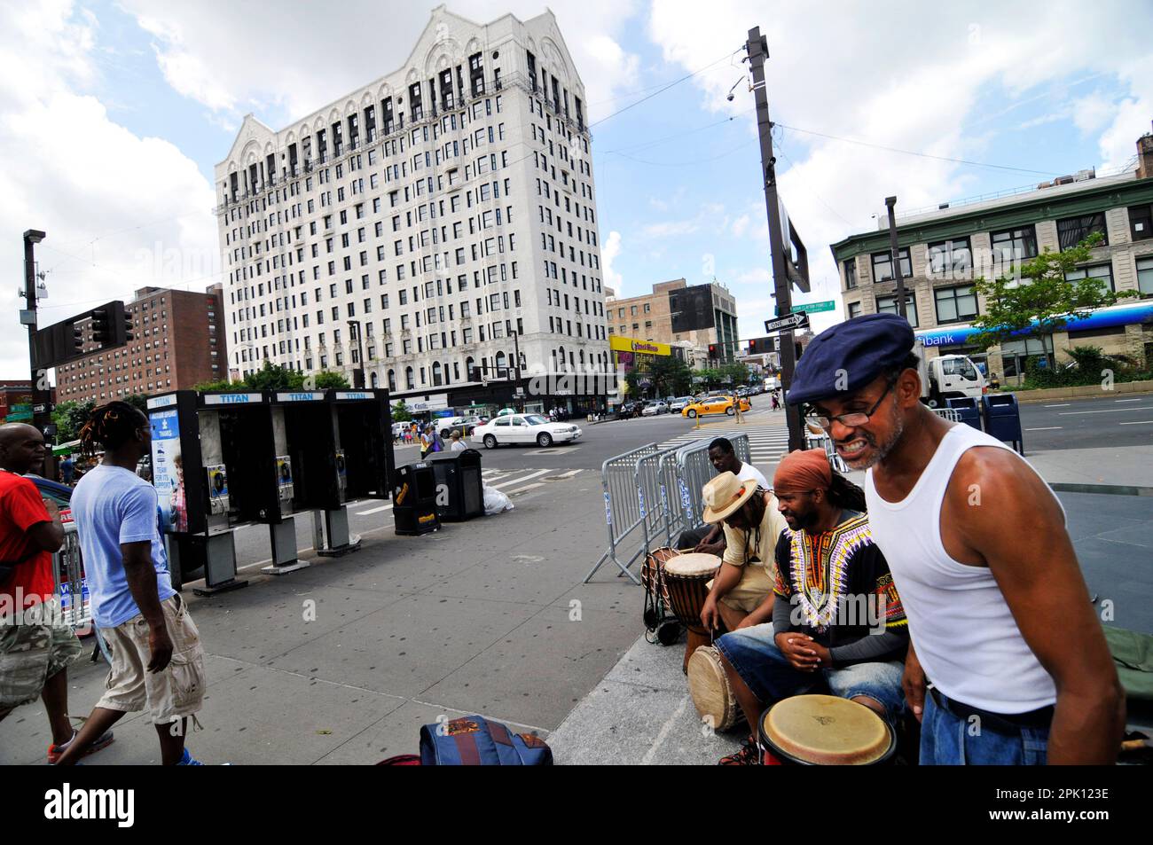 Street musicians playing by the Monument to Adam Clayton Powell in ...