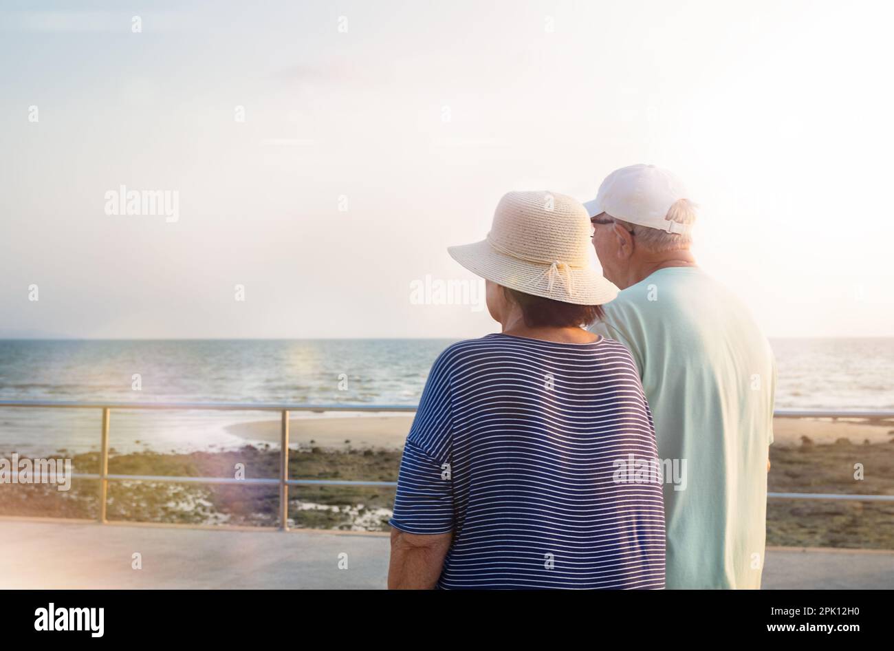 Seniors couple of lovers walk along the promenade together Stock Photo ...