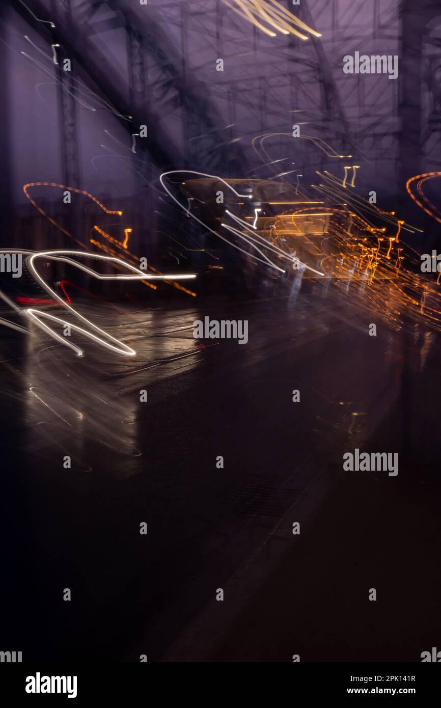 Defocused Lights of cars at night in Krakow bridge. Street line lights ...