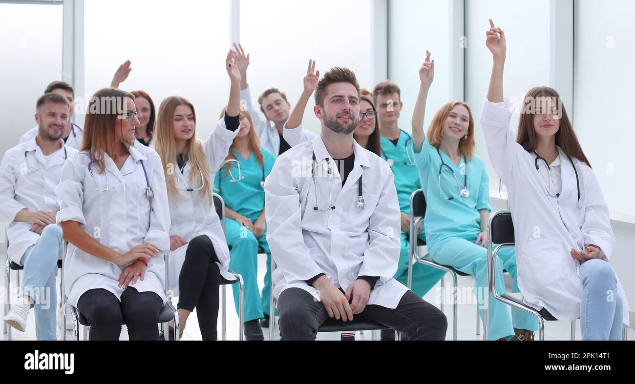 top view. a group of smiling doctors pointing at you Stock Photo - Alamy