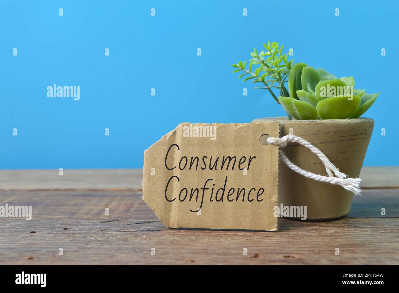 Flower and label tag written with text CONSUMER CONFIDENCE Stock Photo ...