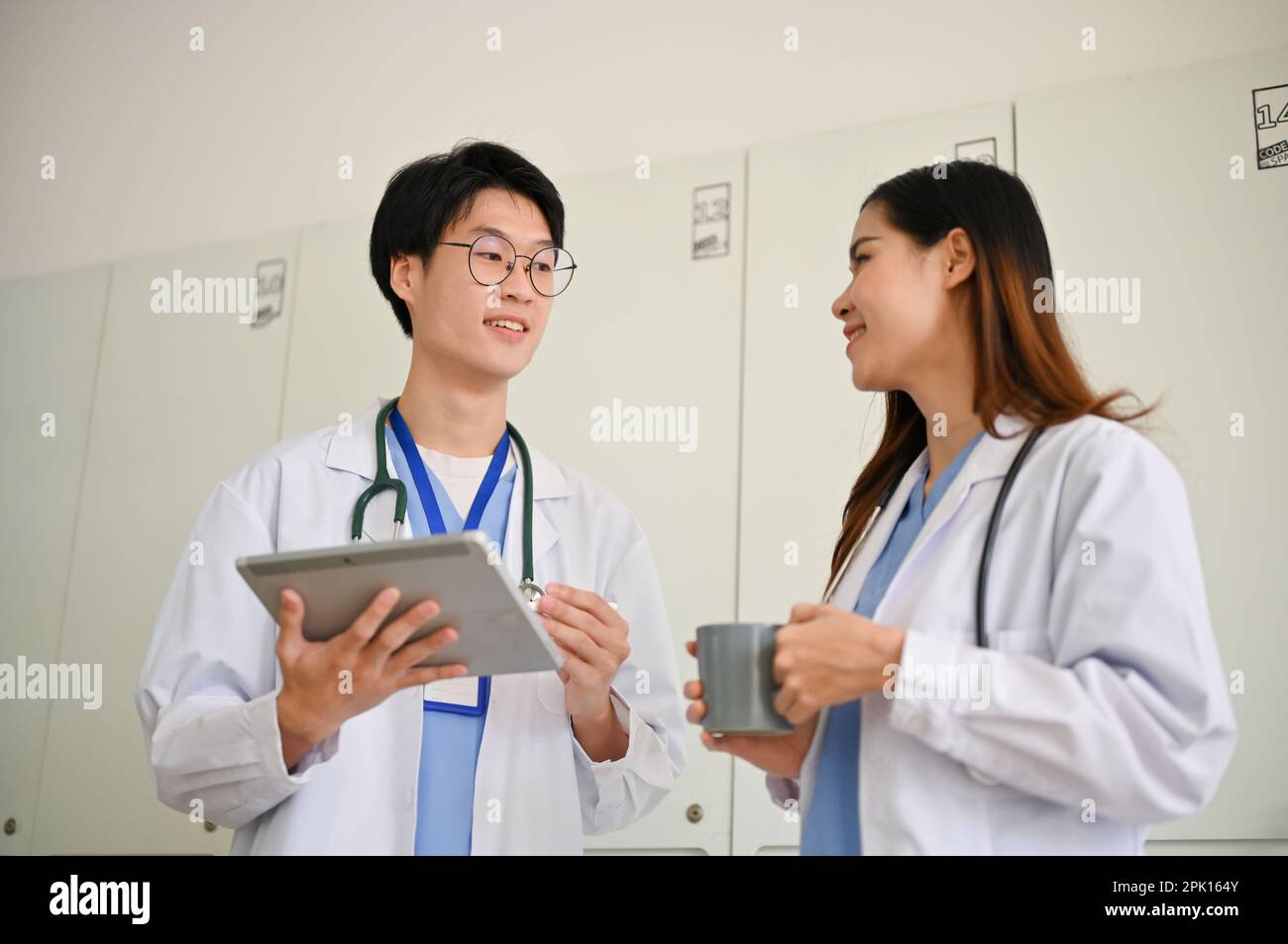 Smart and handsome young Asian male doctor or medical student ...