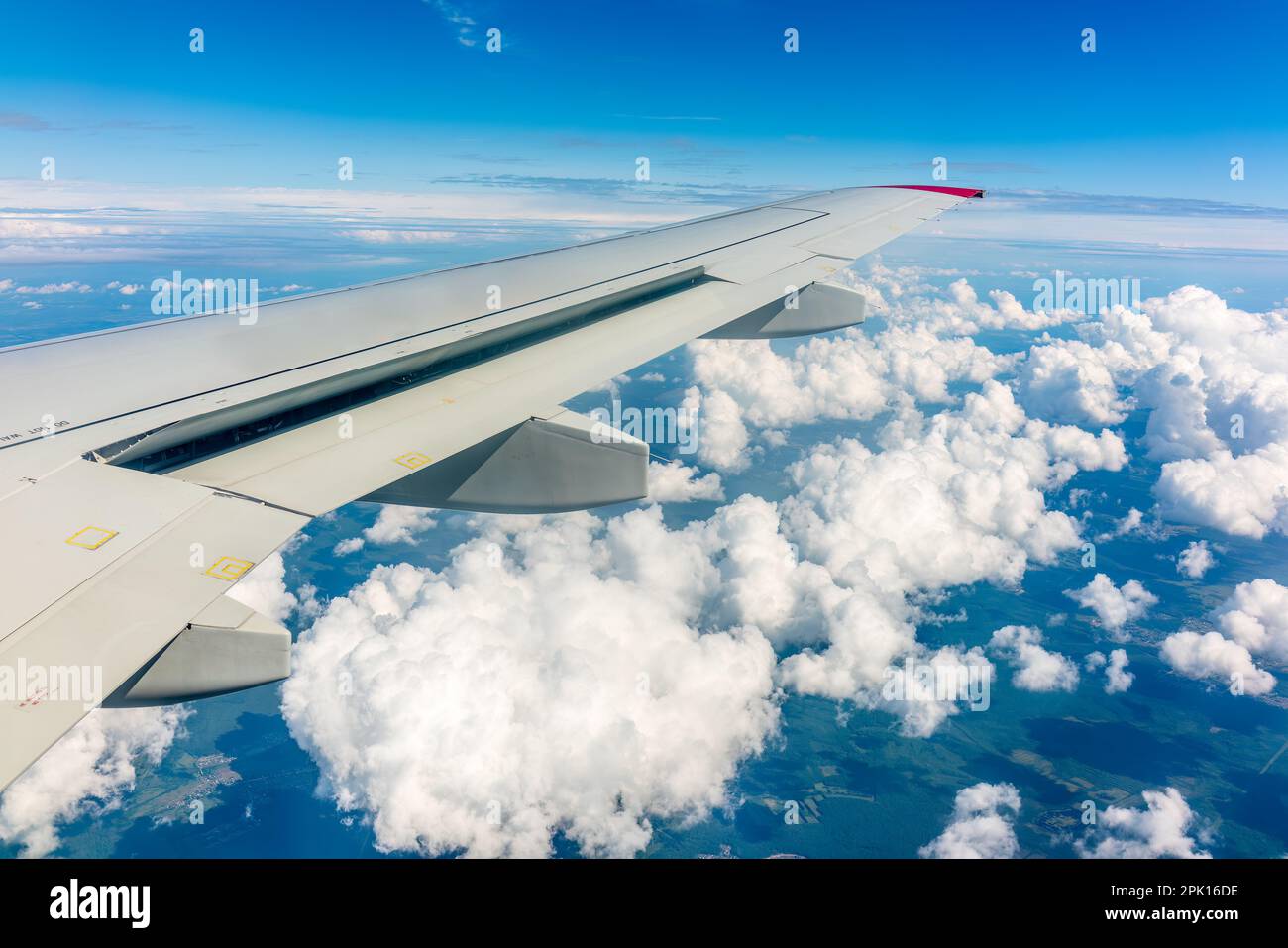 View from the airplane window at a beautiful cloudy sky and the ...