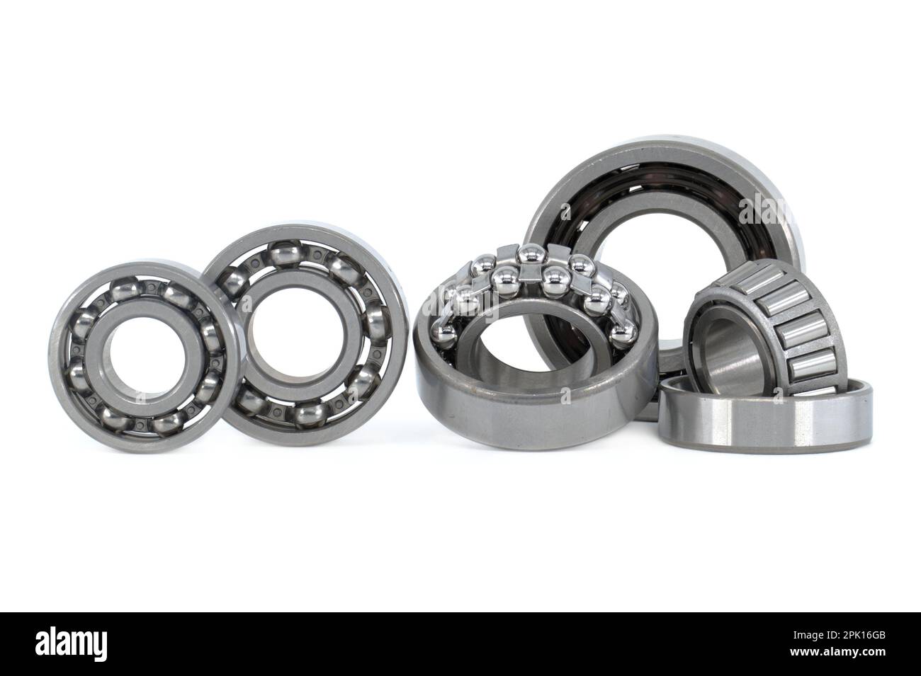 Group of various ball and roller bearings on white background. Spare ...