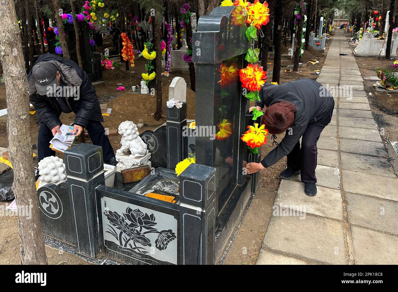 Residents clean a tomb during Qingming festival also known as Tomb ...