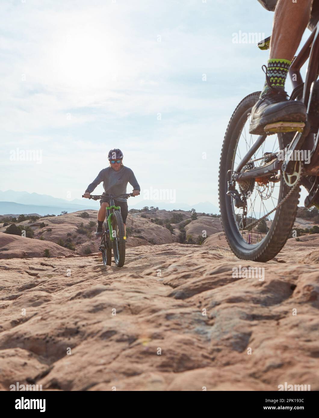 Training for a big bike-athon. two athletic men mountain biking through ...