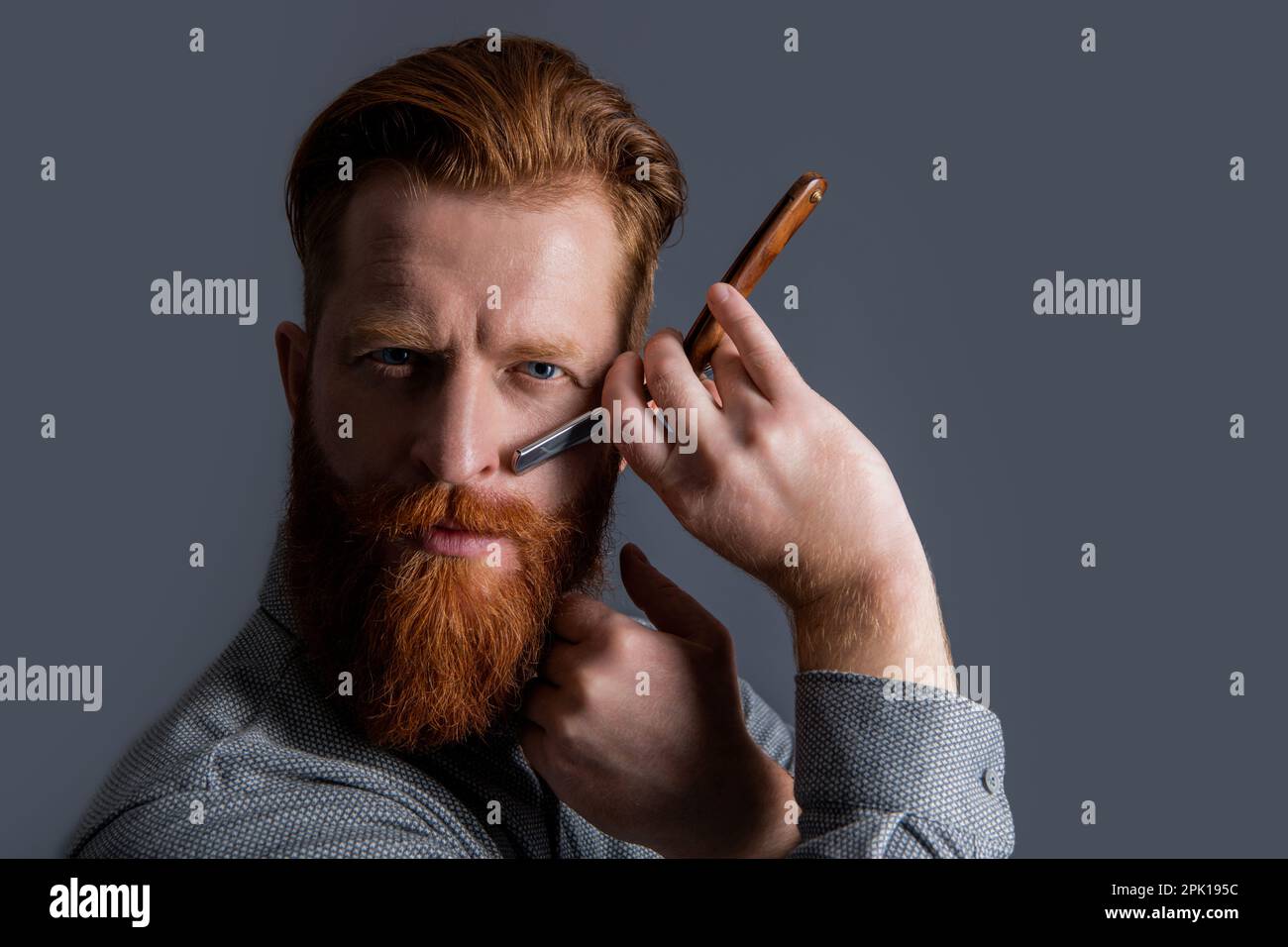 portrait of man hold barbershop blade to shave. man shave with ...