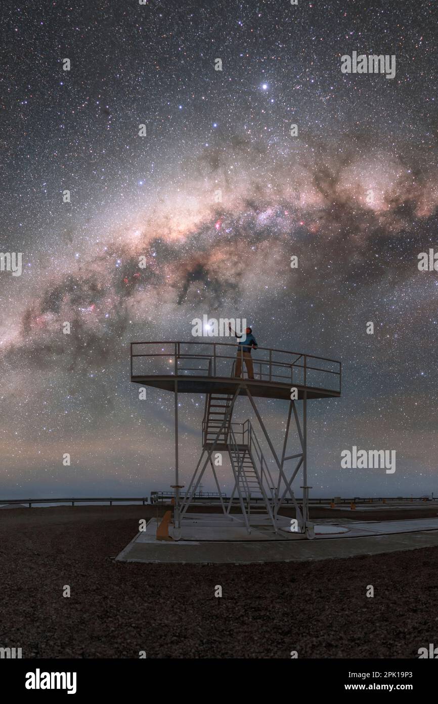 Man standing on platform at night, Chile Stock Photo - Alamy