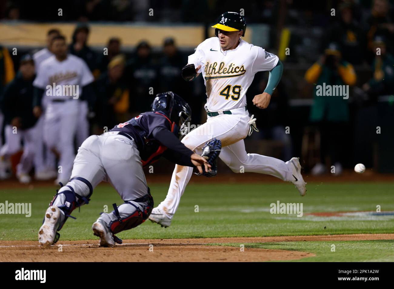 Oakland Athletics' Ryan Noda (49) runs home to score past Cleveland ...