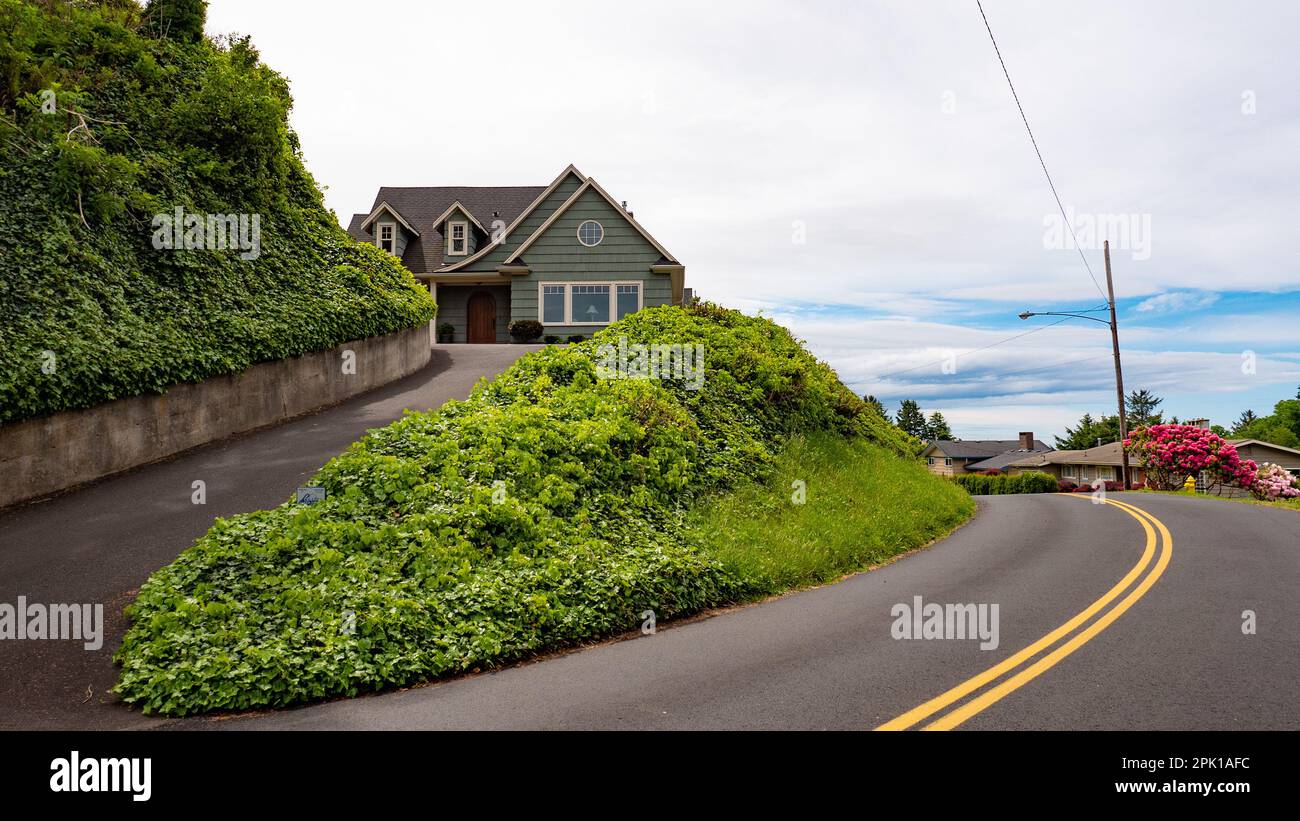 Mansion house on road turn. House with yard in suburbs. Suburban house ...