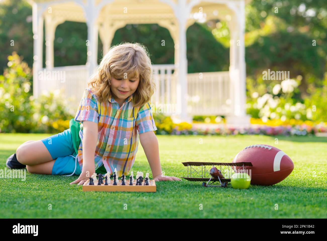 Little kid chessman play chess game, checkmate. Child playing chess in ...