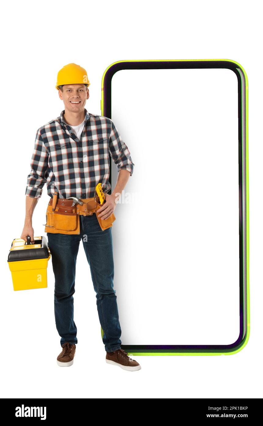 Repair service - just call. Happy professional repairman holding ...