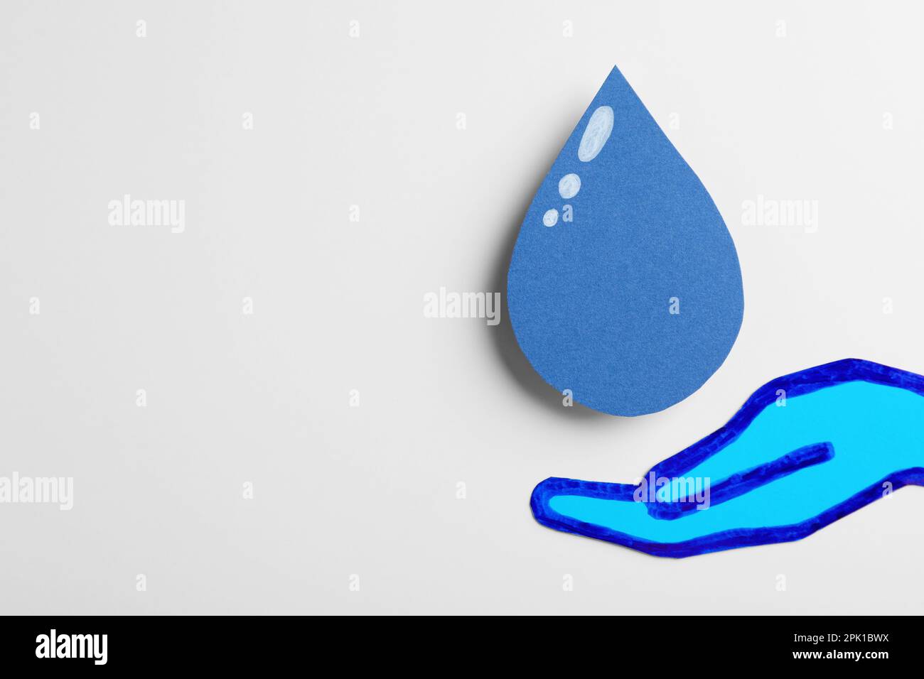 Save Water concept. Paper hand and drop on white background, flat lay ...