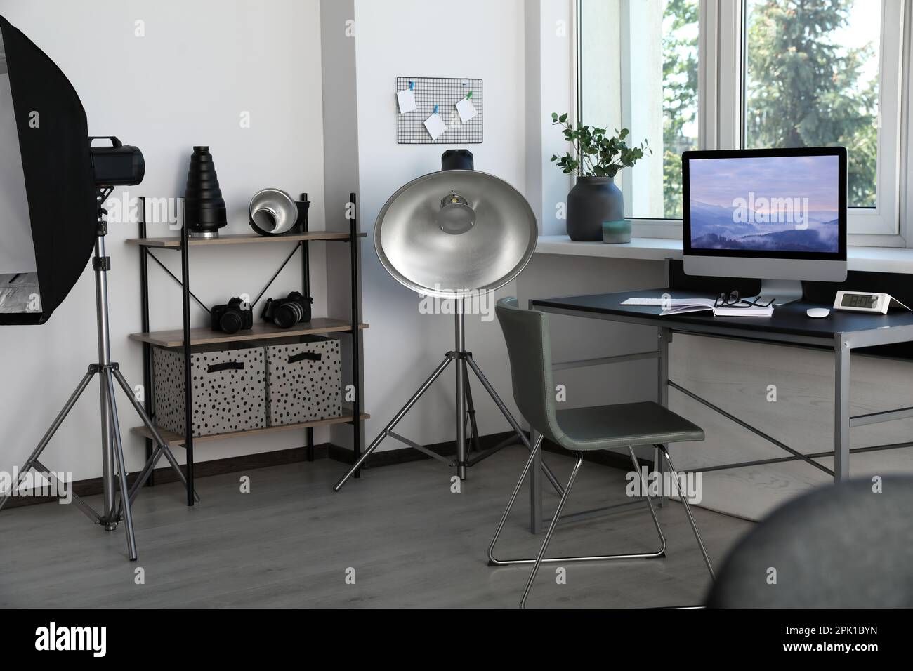 Professional lighting equipment and comfortable workplace in photo ...