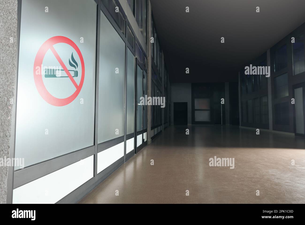 Sign No Smoking drawn on glass wall in office corridor Stock Photo - Alamy