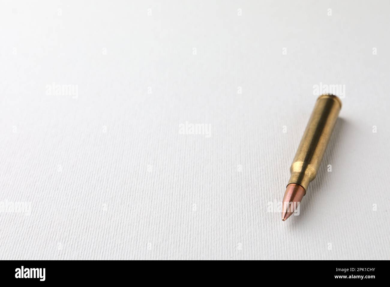 Bullet on white background, closeup. Space for text Stock Photo - Alamy