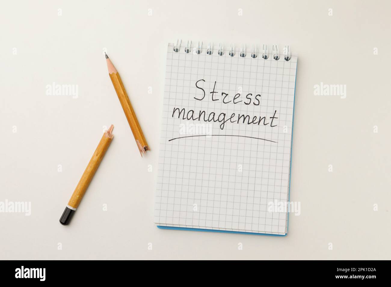 Broken pencil and notepad with inscription Stress Management on white ...