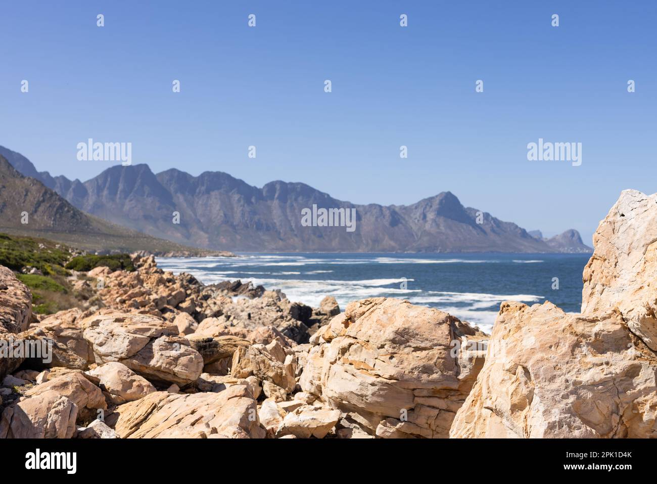 Landscape with mountains, sea, rocks and blue sky, with copy space ...