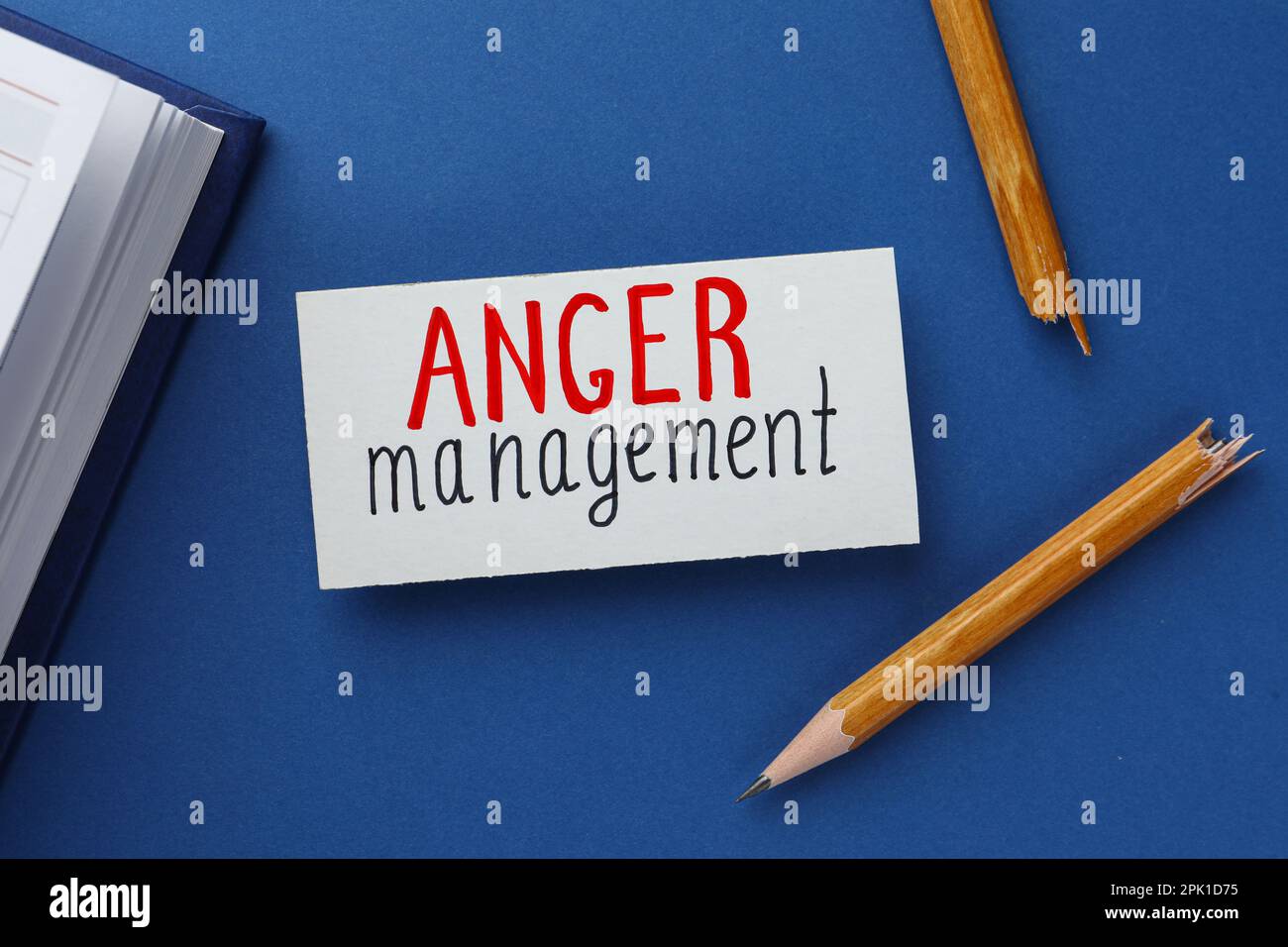 Card with words Anger Management, notebook and broken pencil on blue ...