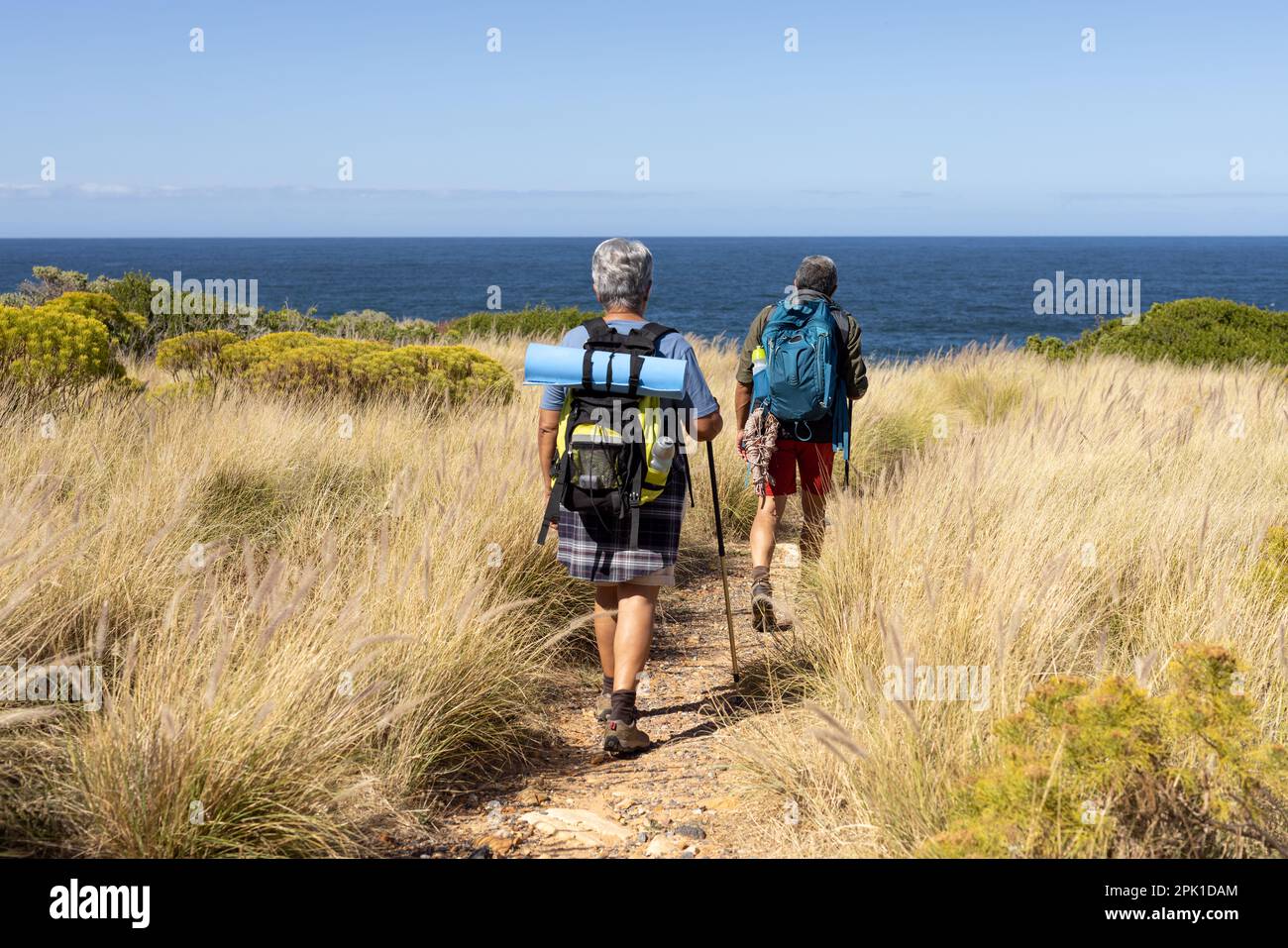 Senior couple backpacks hiking poles hi-res stock photography and ...