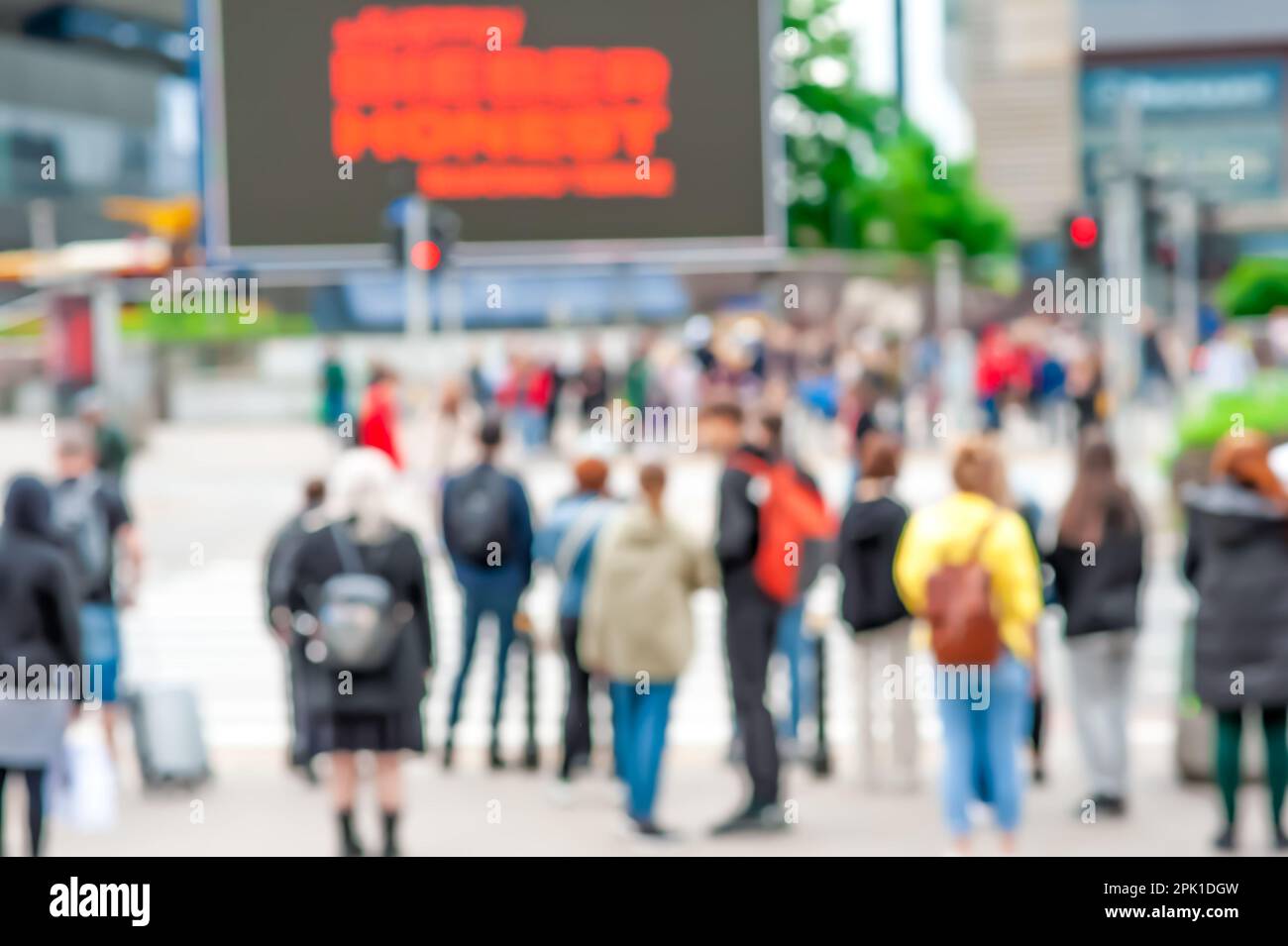 People waiting to cross street in city, blurred view Stock Photo - Alamy