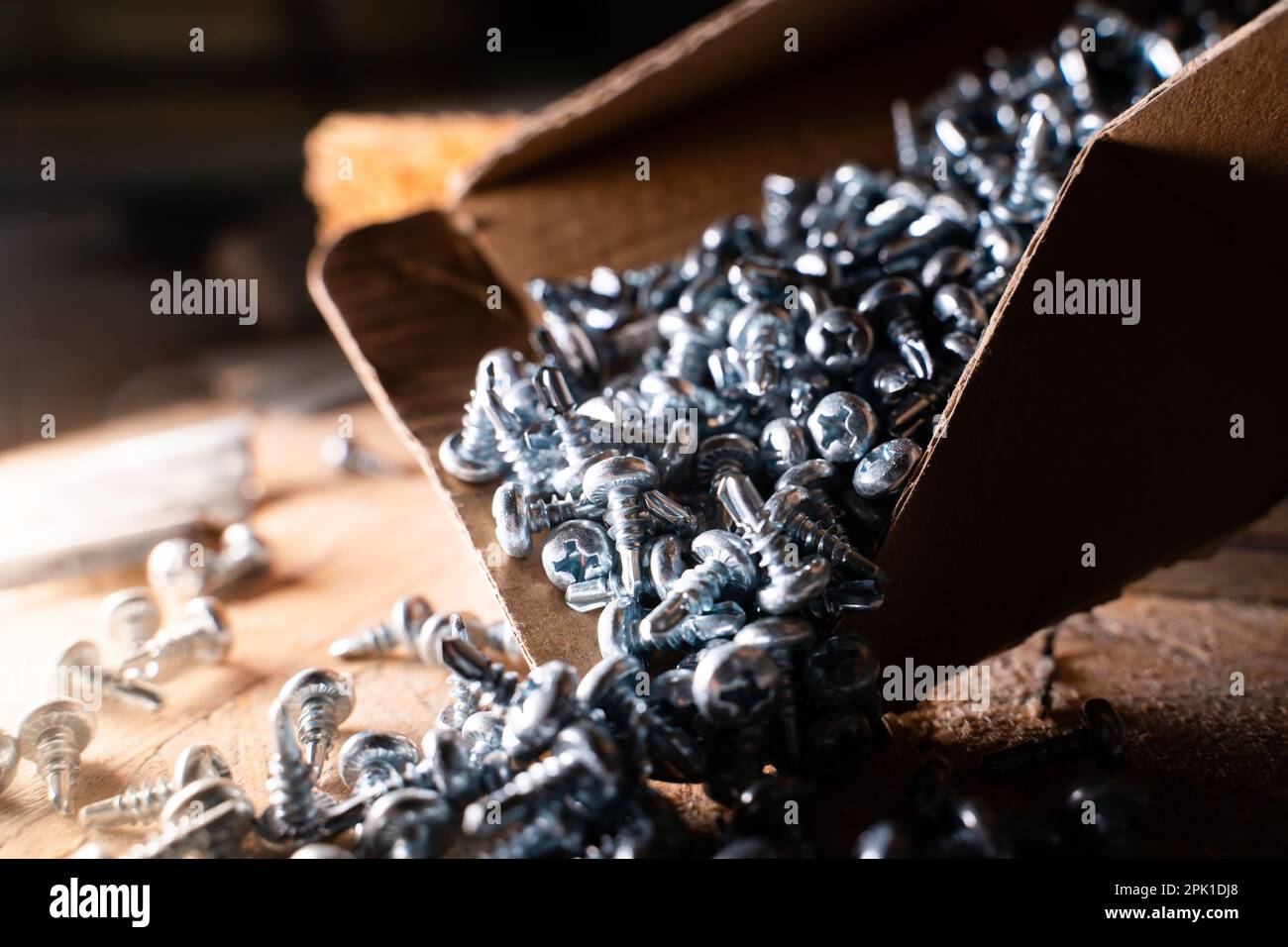 Shiny small self-tapping screws for the metal profile crumbled out of ...