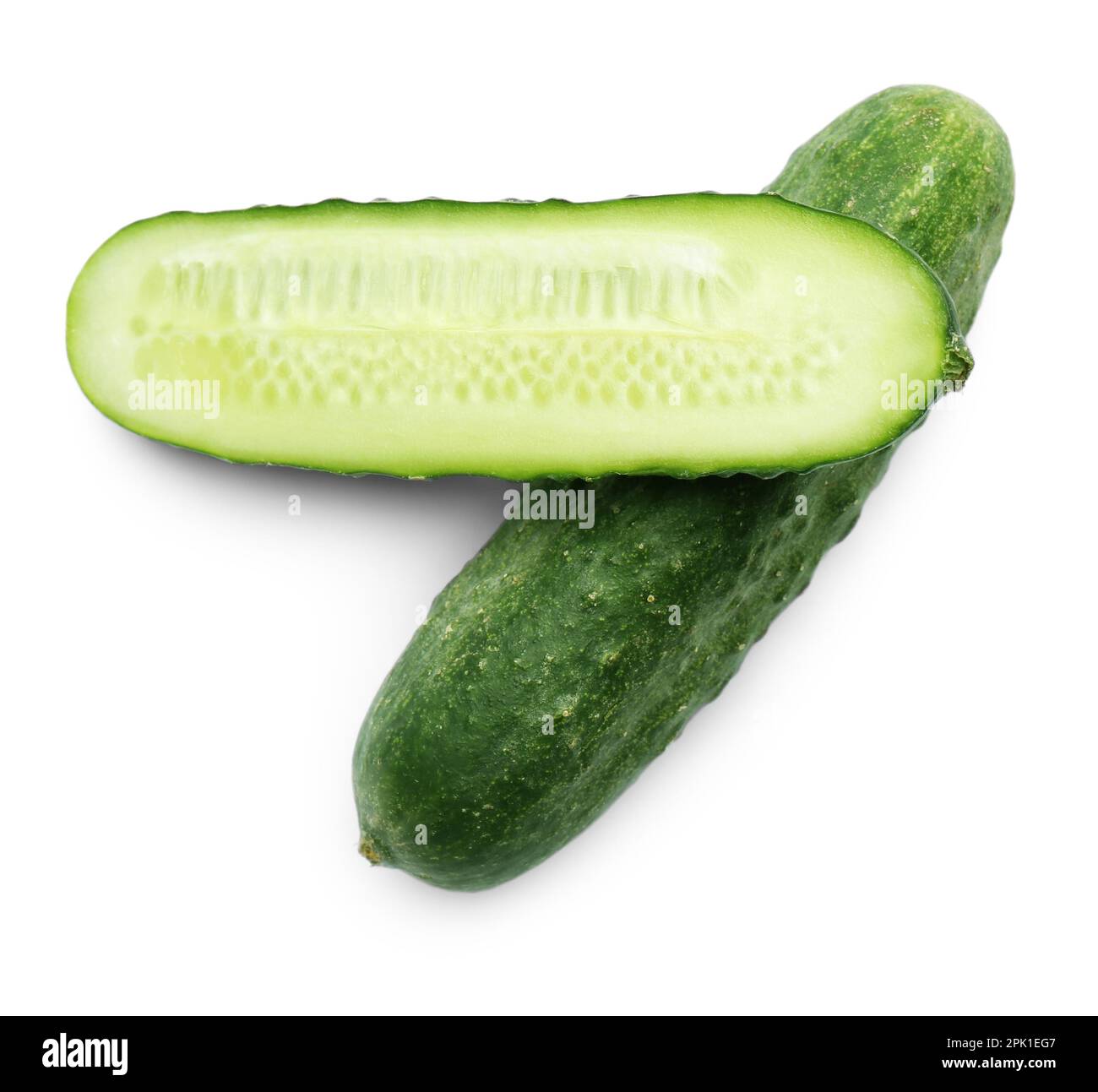 Whole and cut cucumbers on white background, top view Stock Photo - Alamy