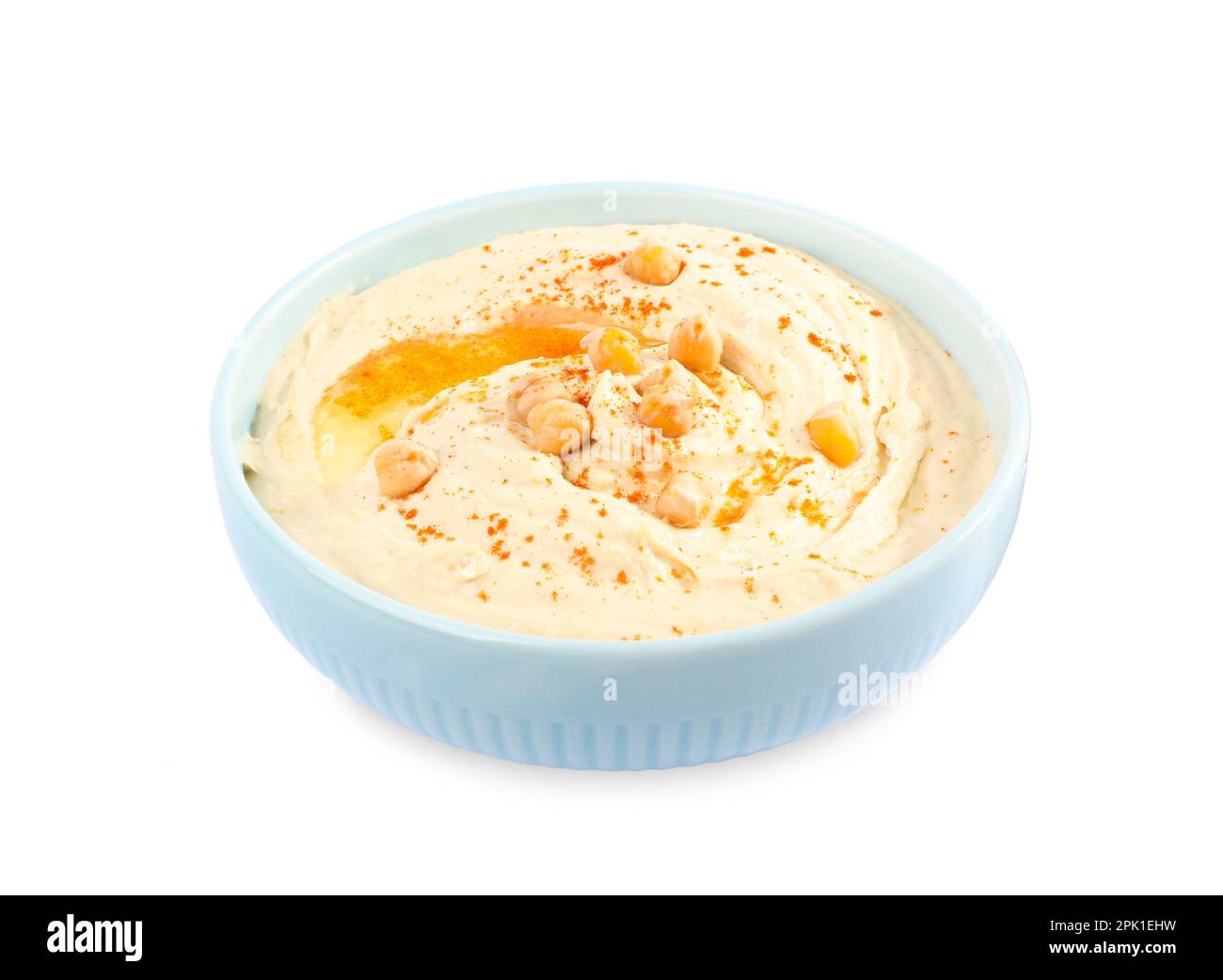 Tasty hummus with garnish in bowl isolated on white Stock Photo - Alamy