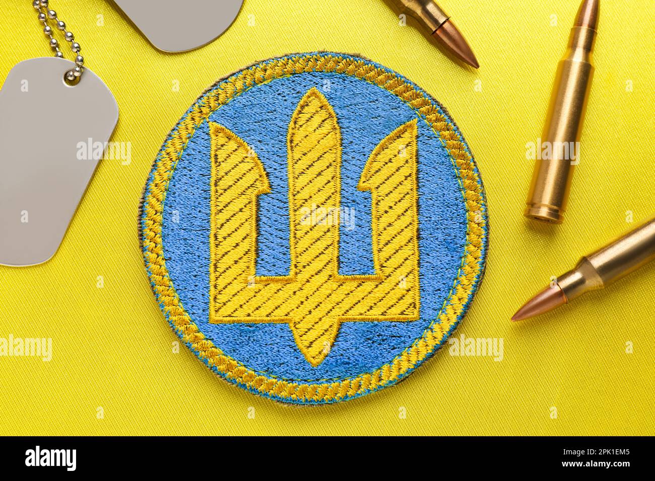Flat lay composition with Ukrainian army chevron, military ID tags and ...