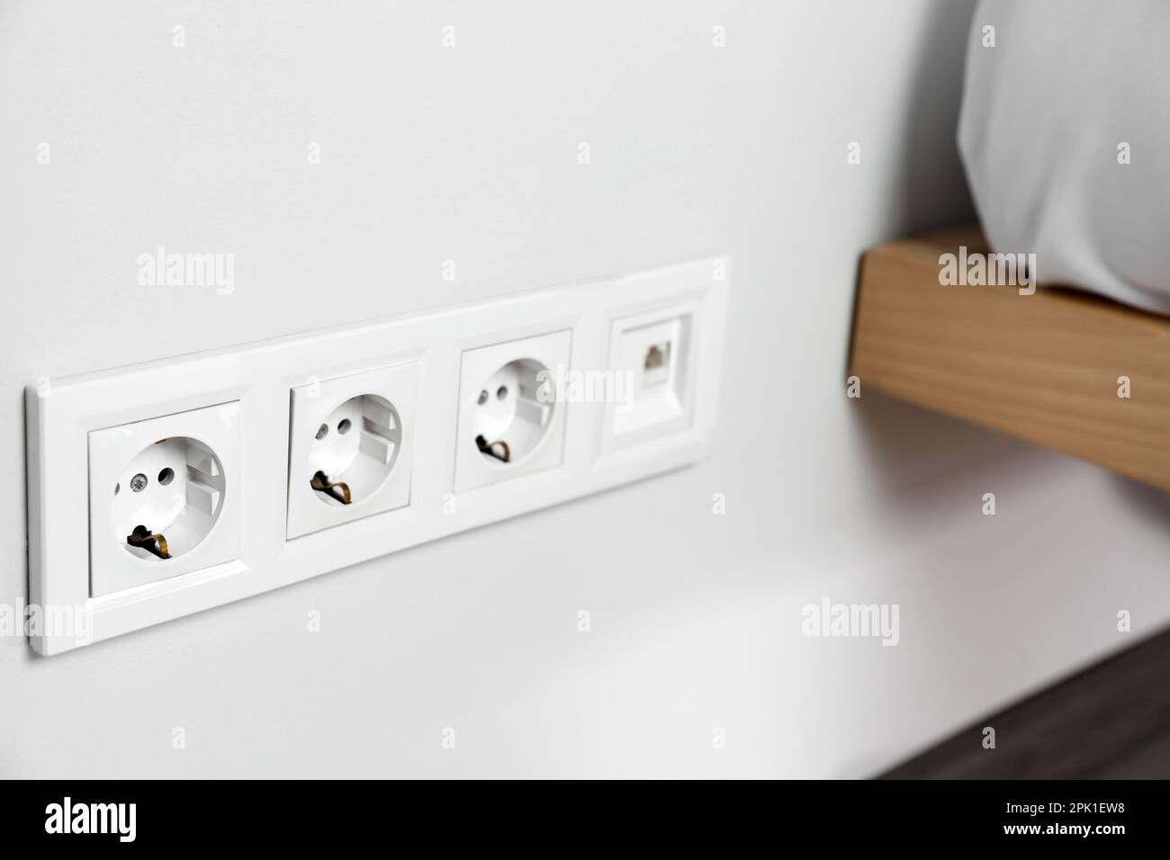 Power sockets on white wall indoors, closeup. Electrical supply Stock ...