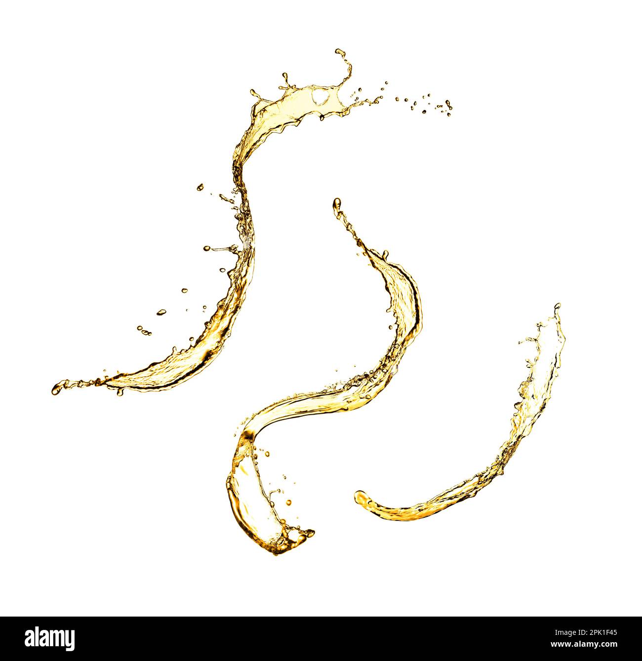 Splashes of golden oily liquid on white background Stock Photo - Alamy