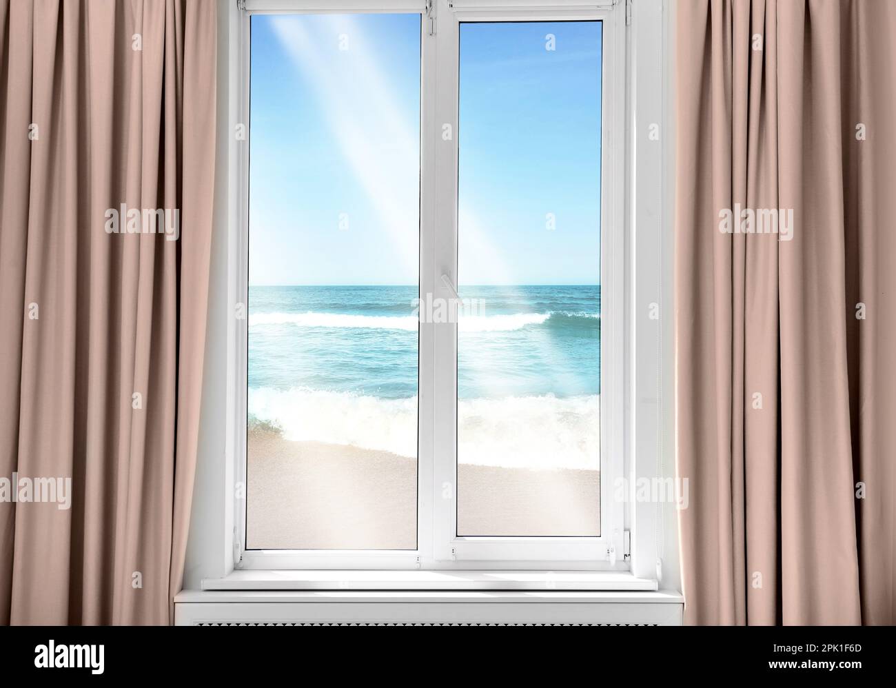 Beautiful view of sandy beach washed by sea on sunny day through window ...