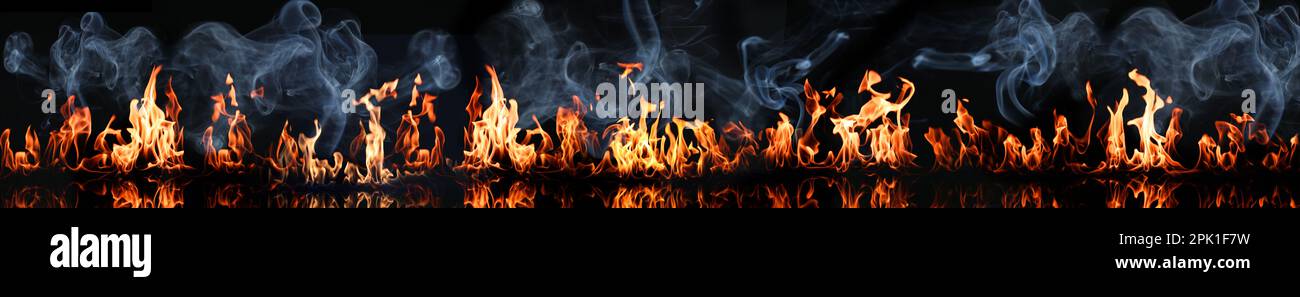 Bright fire flames with smoke on black background. Banner design Stock ...