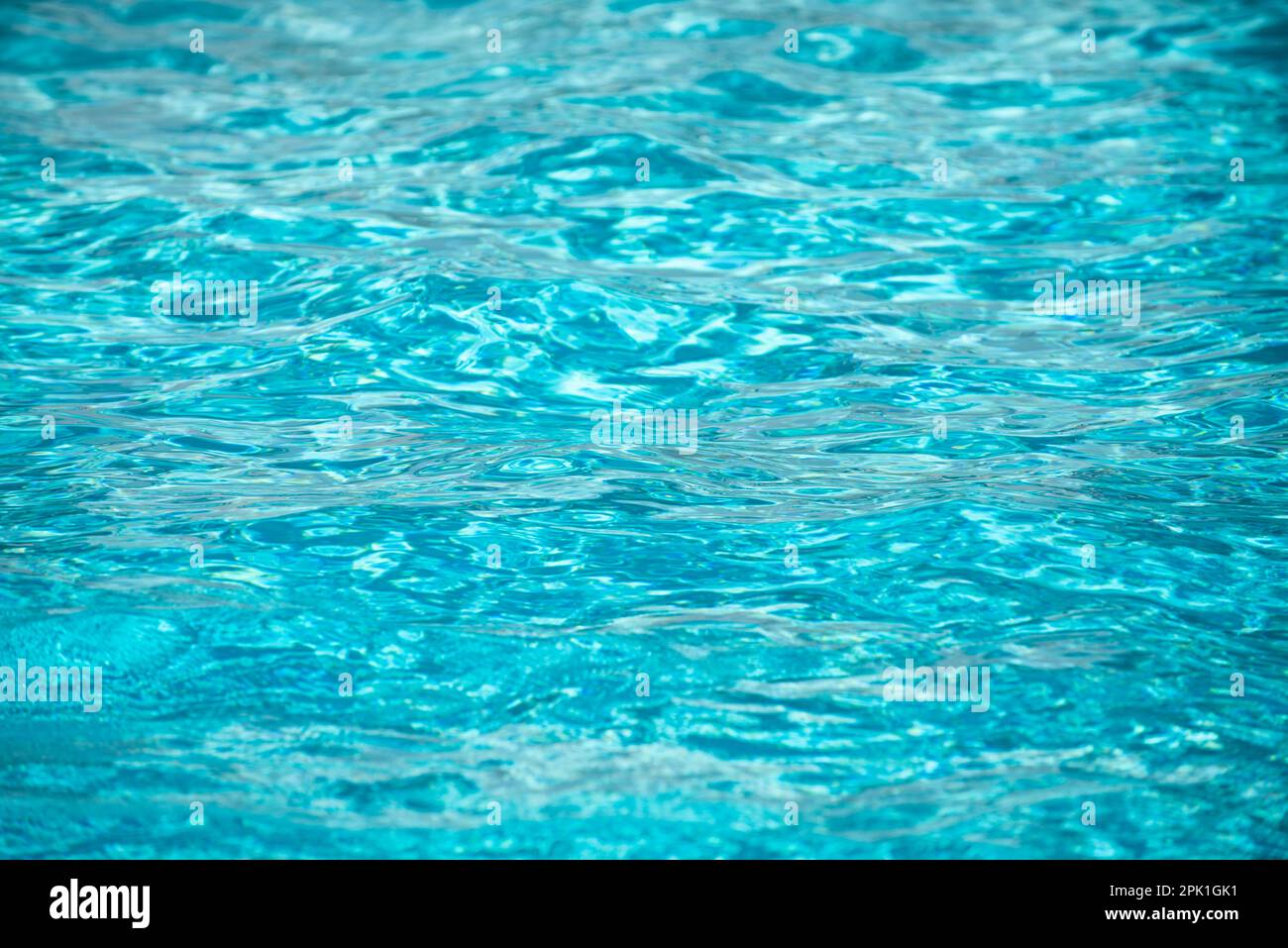 Background of blue water in swimming pool with sun reflection, ripple ...