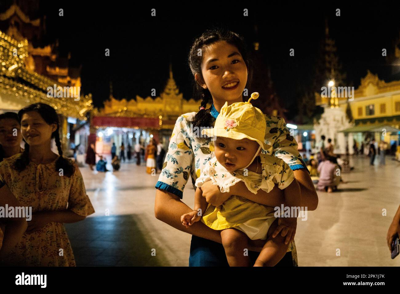 Yangon, Myanmar. 05th Apr, 2023. A mother poses for a portrait with ...