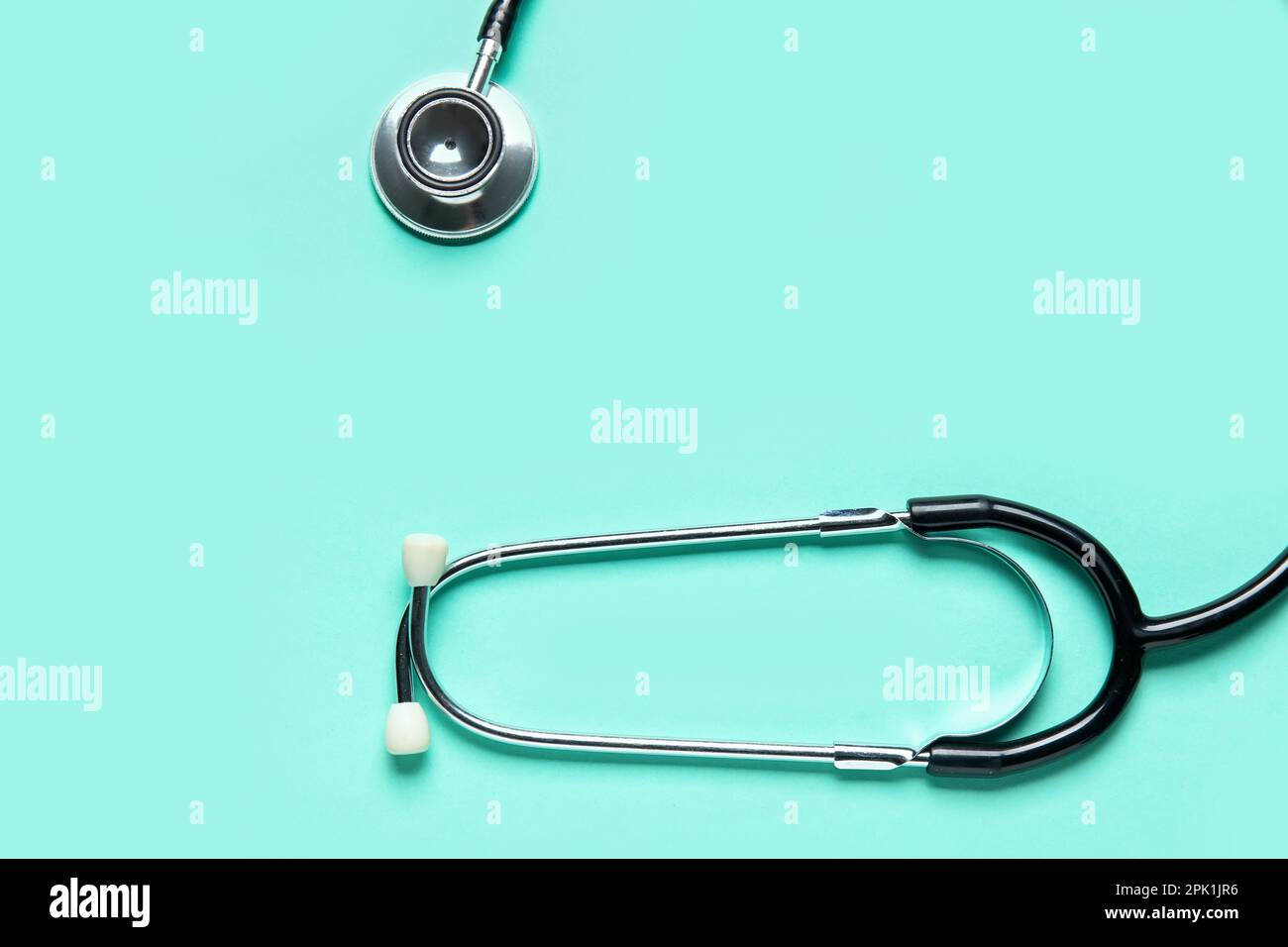 Modern stethoscope on turquoise background Stock Photo - Alamy