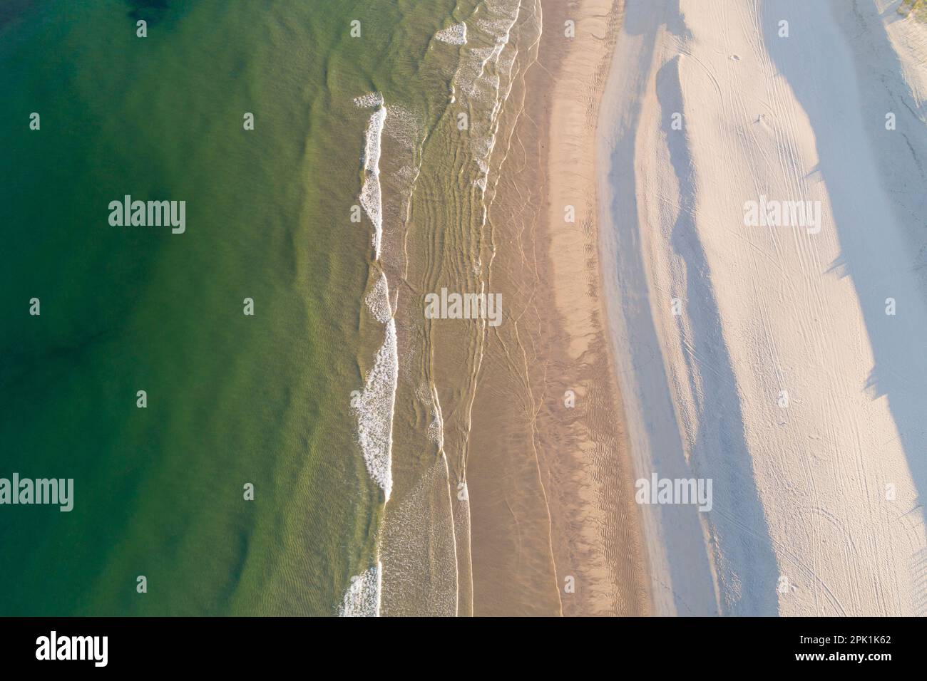 aerial drone view of a beach shore at sunrise, summer concept Stock ...