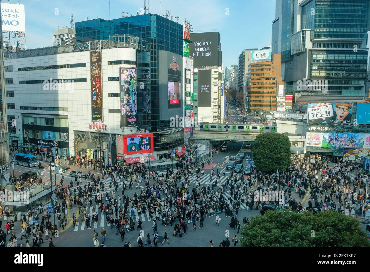 Tokyo, Japan - March 4, 2023: People passing through the famous Shibuya ...