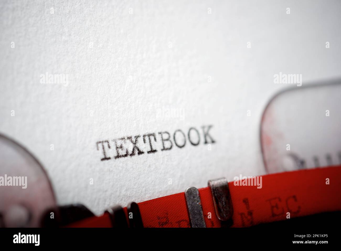 Textbook word written with a typewriter Stock Photo - Alamy