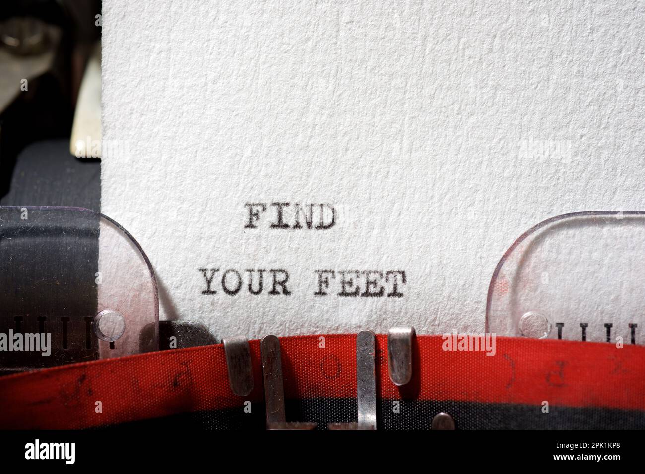 Find your feet text written with a typewriter Stock Photo - Alamy