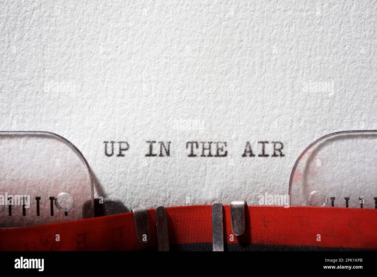 Up in the air text written with a typewriter Stock Photo - Alamy
