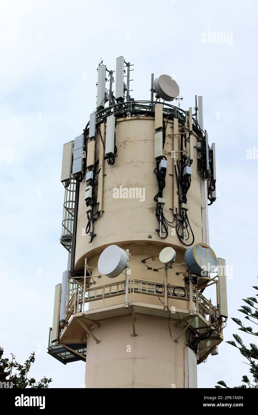 a radio and phone signal tower on top of a water tower North QLD Stock ...