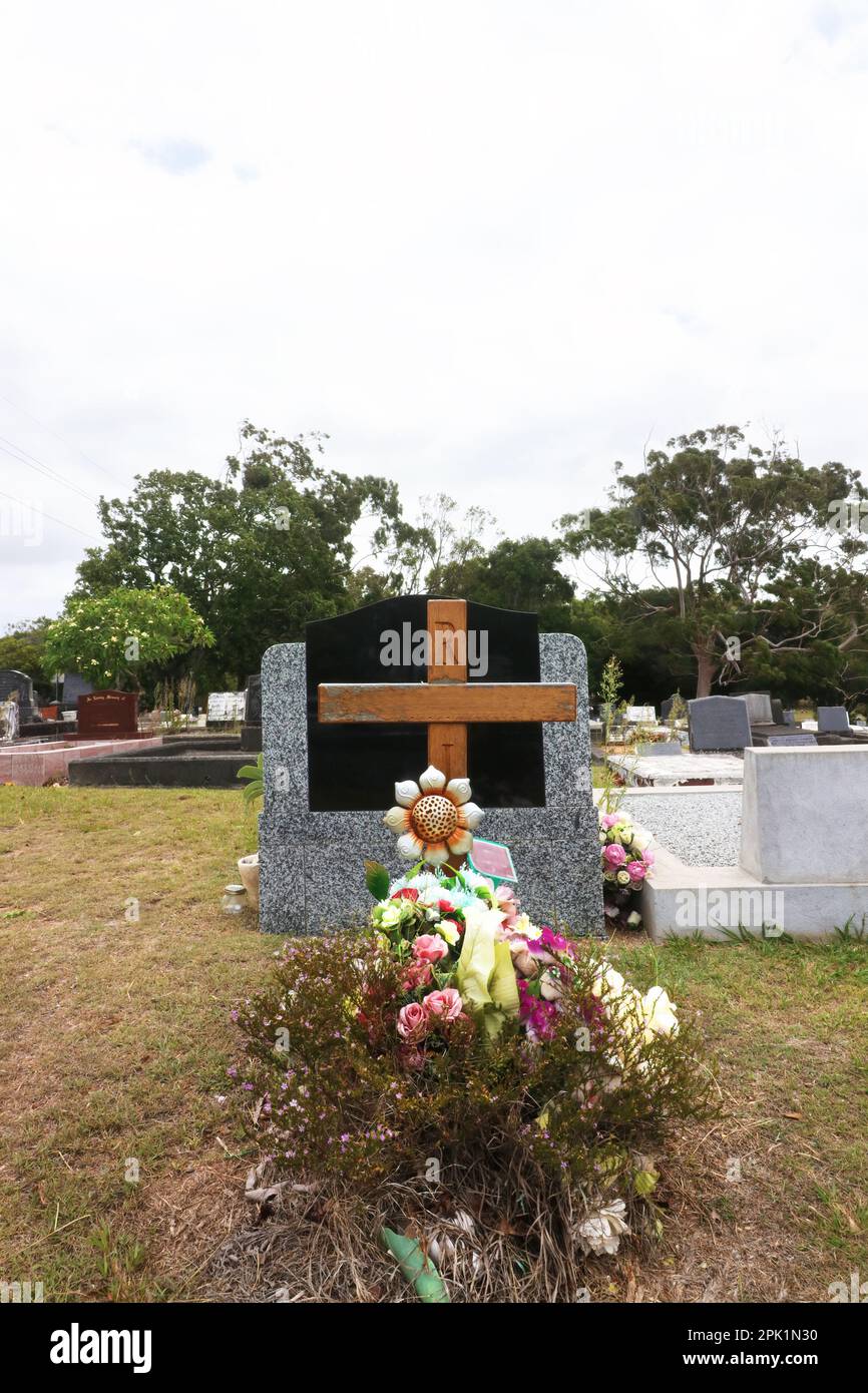 A few images of grave sites with headstones, flowers and death, at a ...