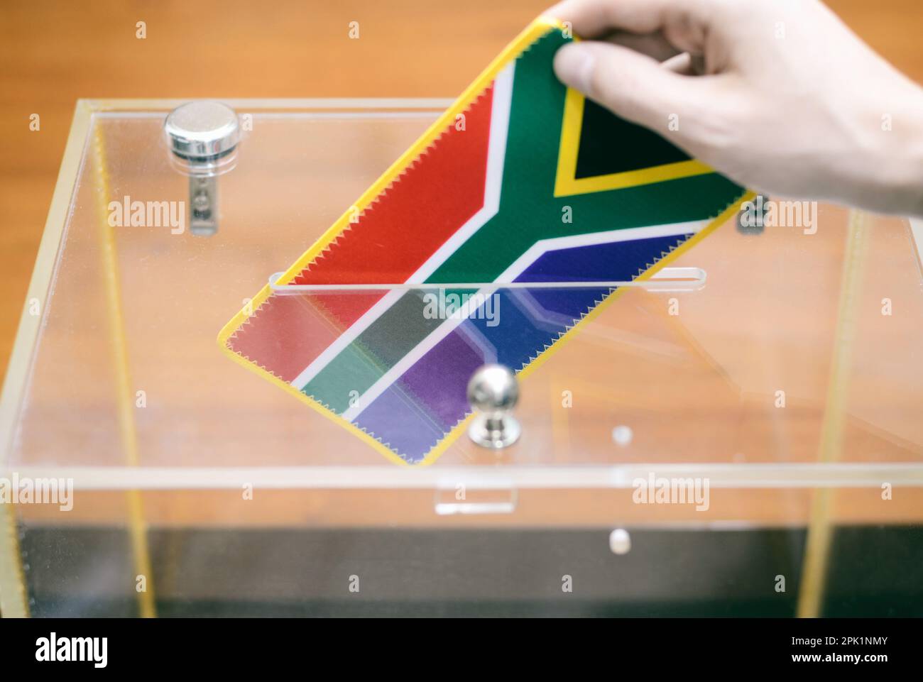 Man inserting Flag of South Africa into ballot box, voting and ...